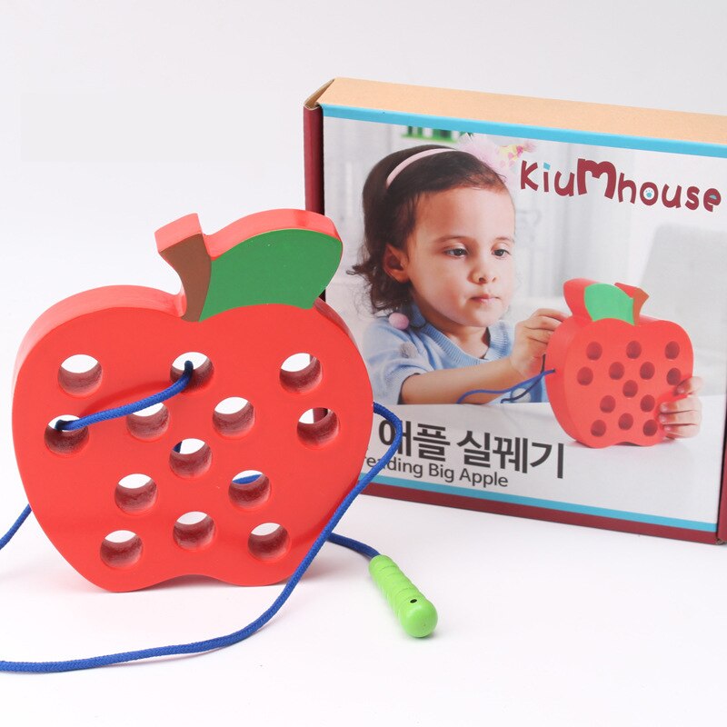 Puinen vauva mato syö omenaa hedelmä helmet naruss... – Vicedeal