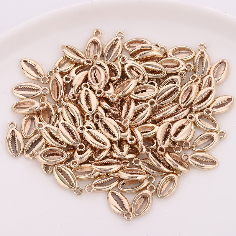 50pcs 10x18mm Shells Charms Gold Color Cowrie Conc... – Grandado