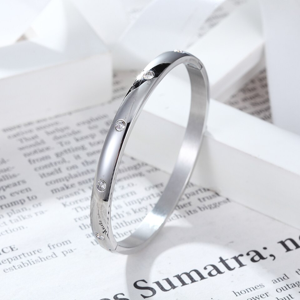 Beautiful Curved Face Inlaid With 10 Zircon Bangle... – Grandado