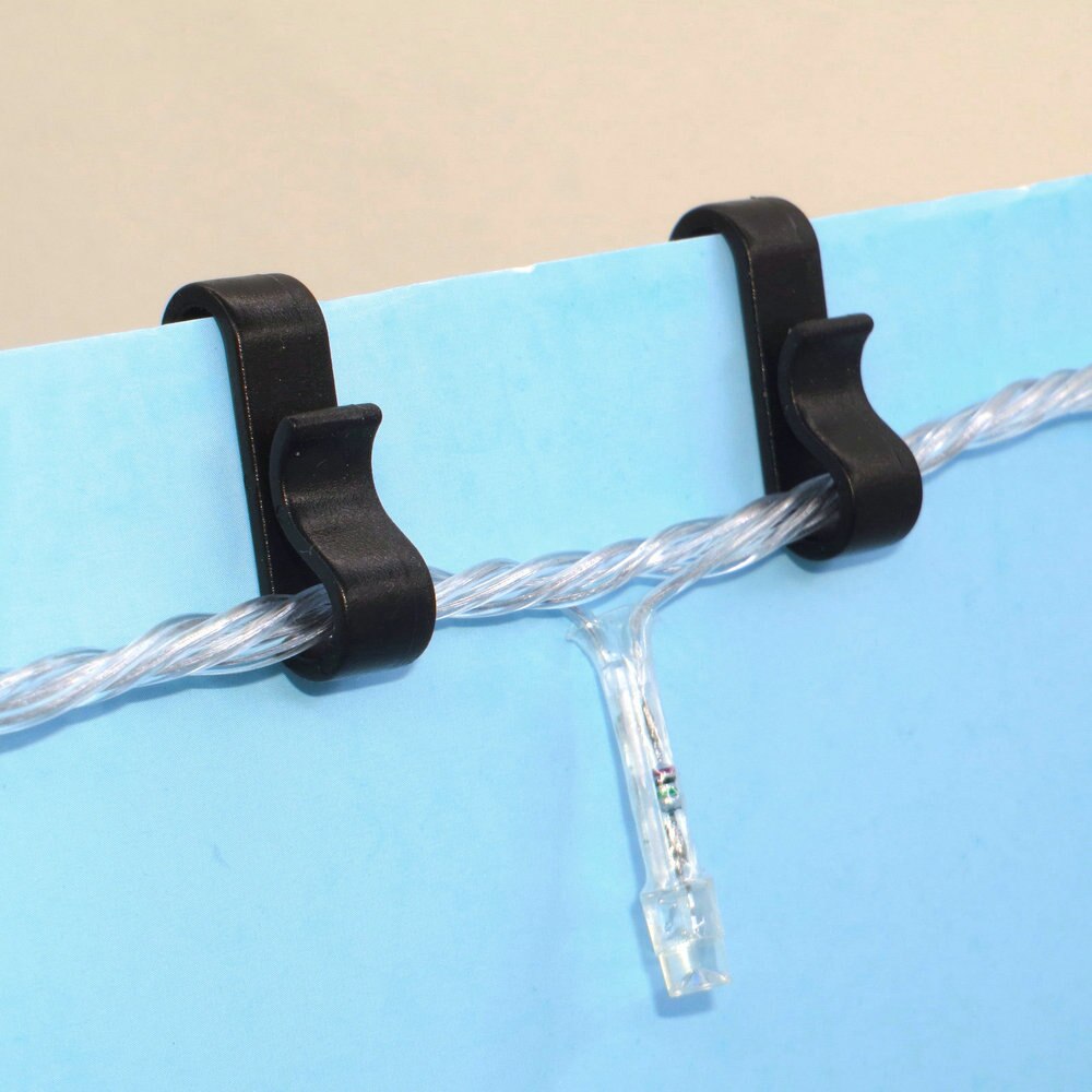 Pakke of 50 mini tagrende hængekroge julelys clip... – Grandado